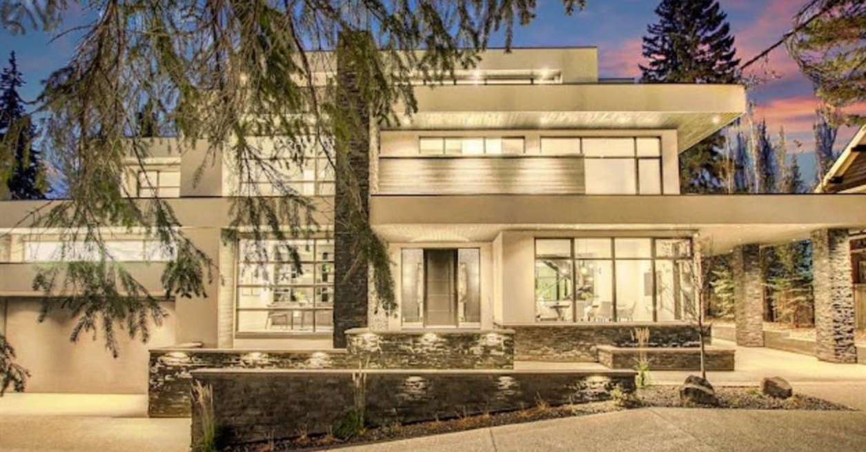 This modern Alberta mansion for sale has an elevator & a golf simulator